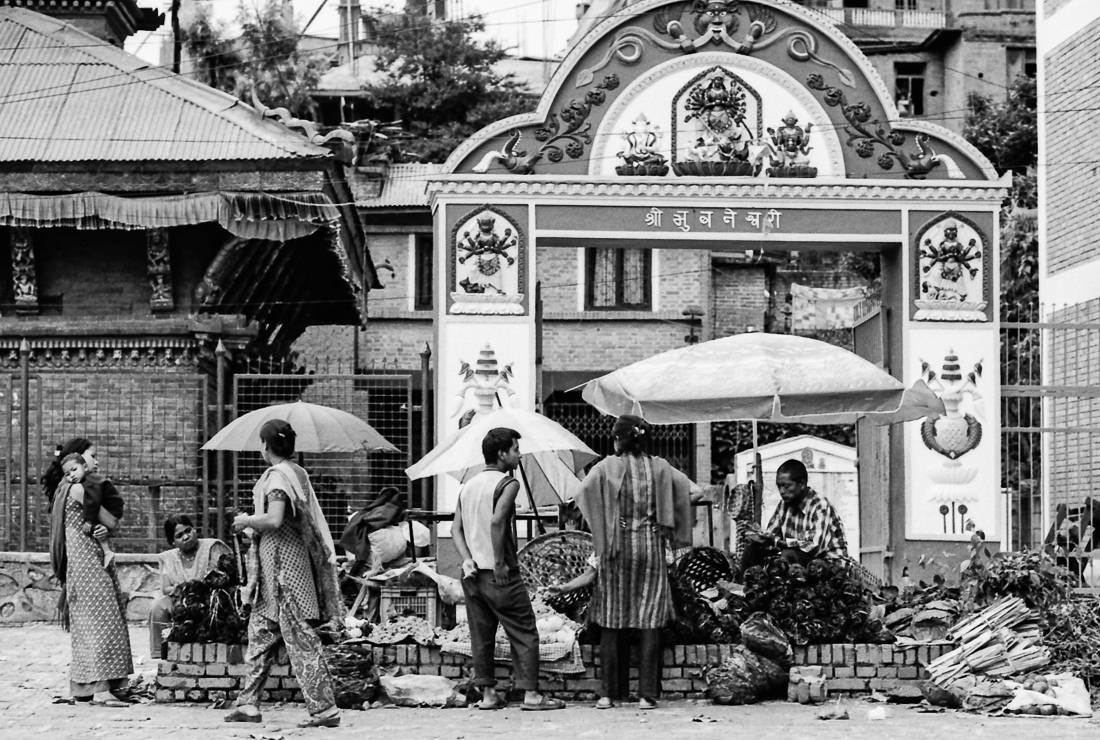 Hawkers Displaying Vegetables In Front Of A Gate Nepal Travel Photo